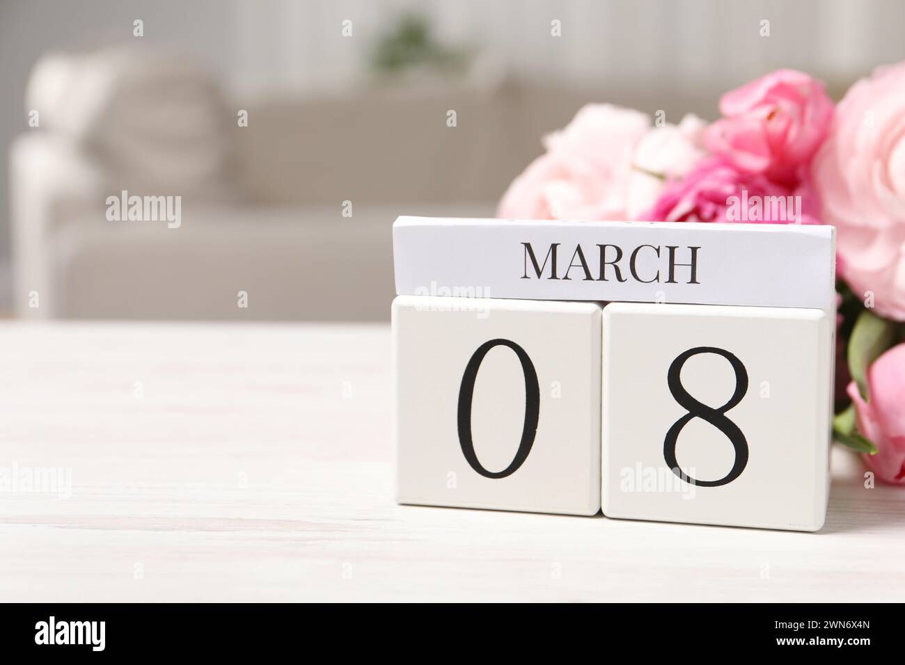 International Women's day - 8th of March. Block calendar and bouquet of ...