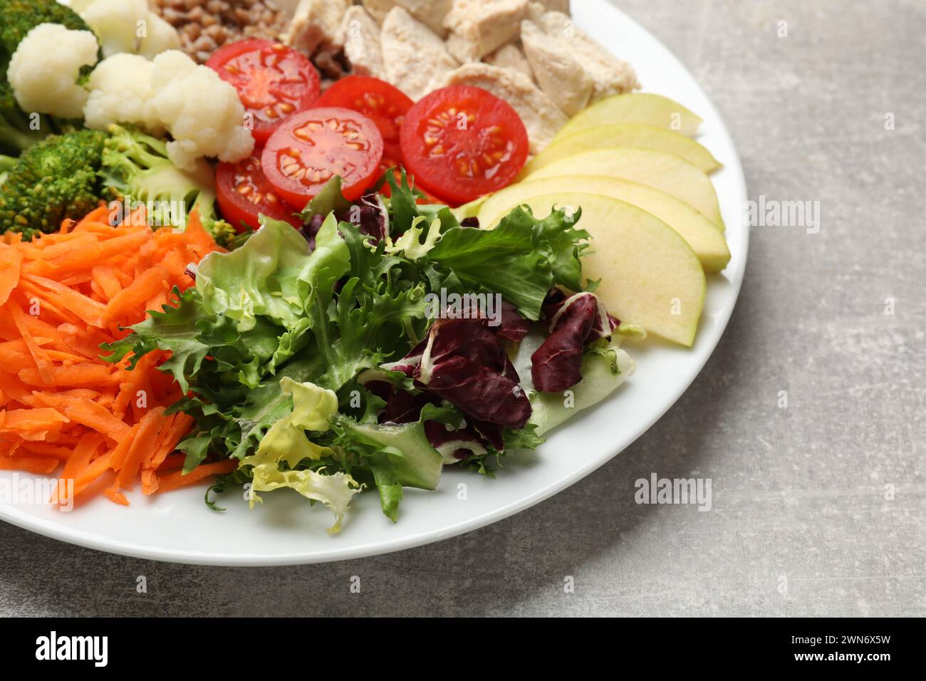 Balanced diet and healthy foods. Plate with different delicious ...