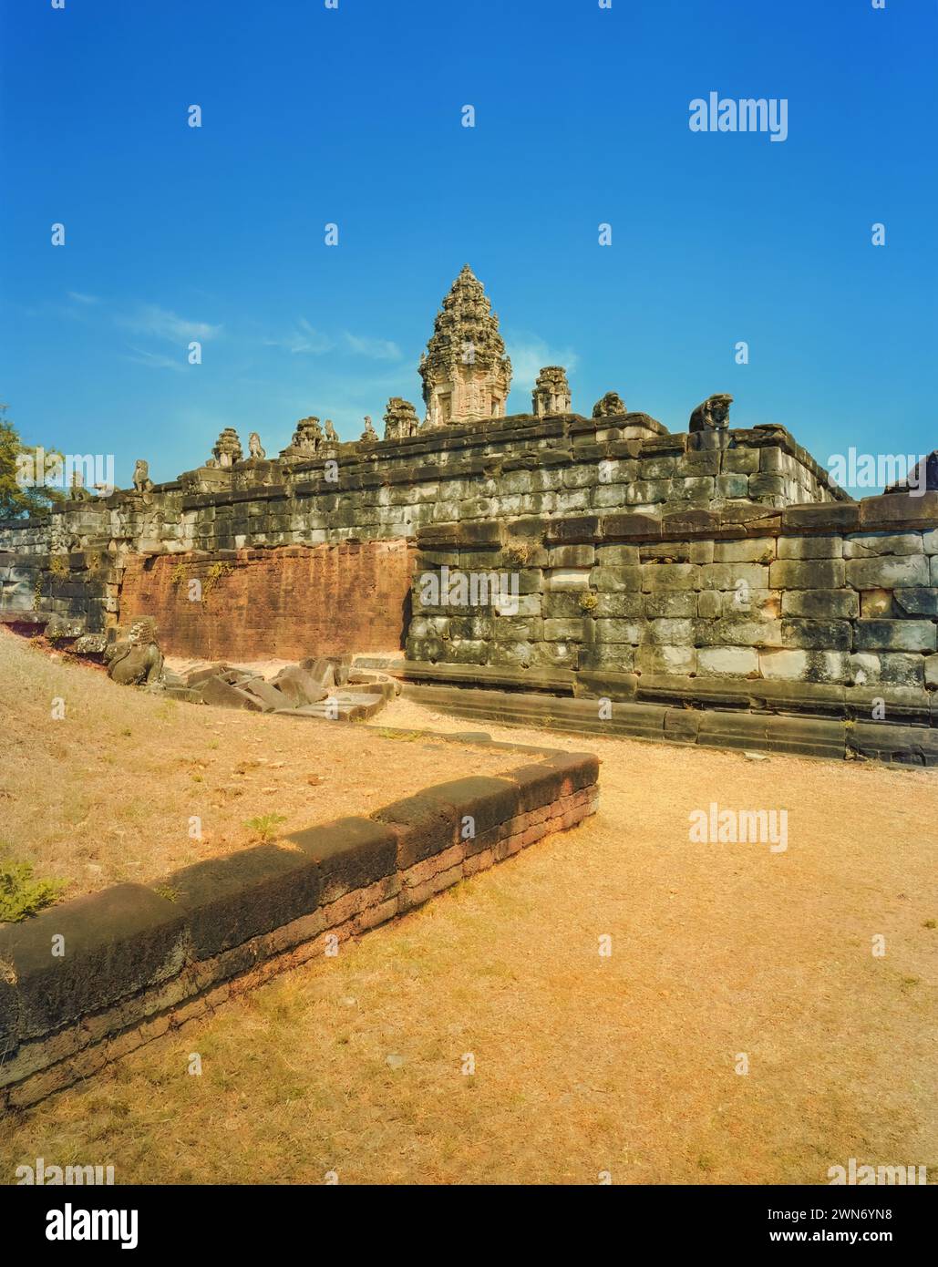 Tall stone walls surrounding the Bakong temple, Roulos, near Siem Reap ...