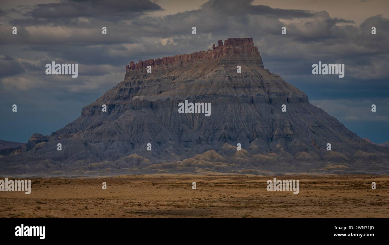 Cloudy day roadside photo of the amazing Factory Butte, Utah, USA Stock ...