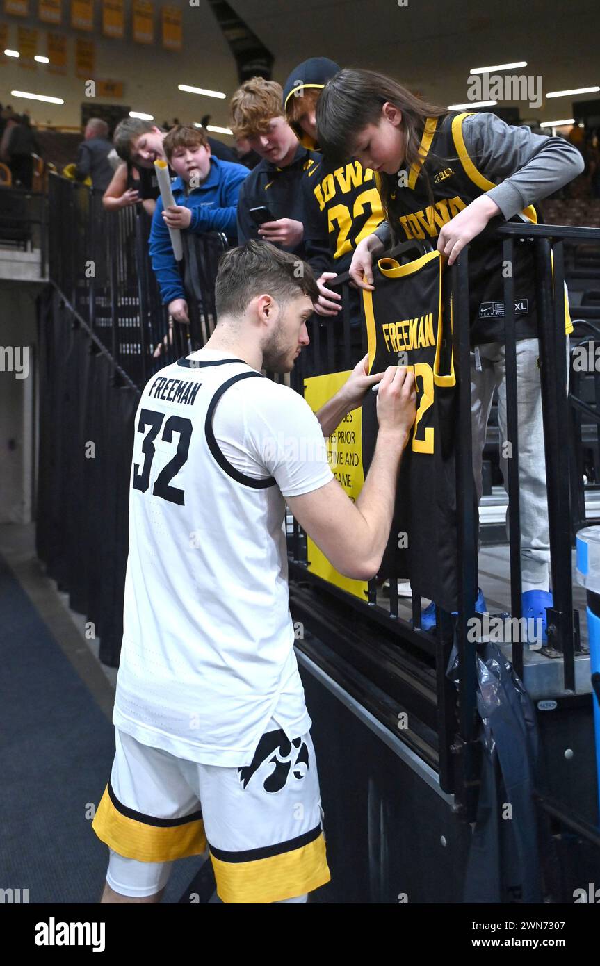 IOWA CITY, IA - FEBRUARY 27: Iowa forward Owen Freeman (32) signs an ...