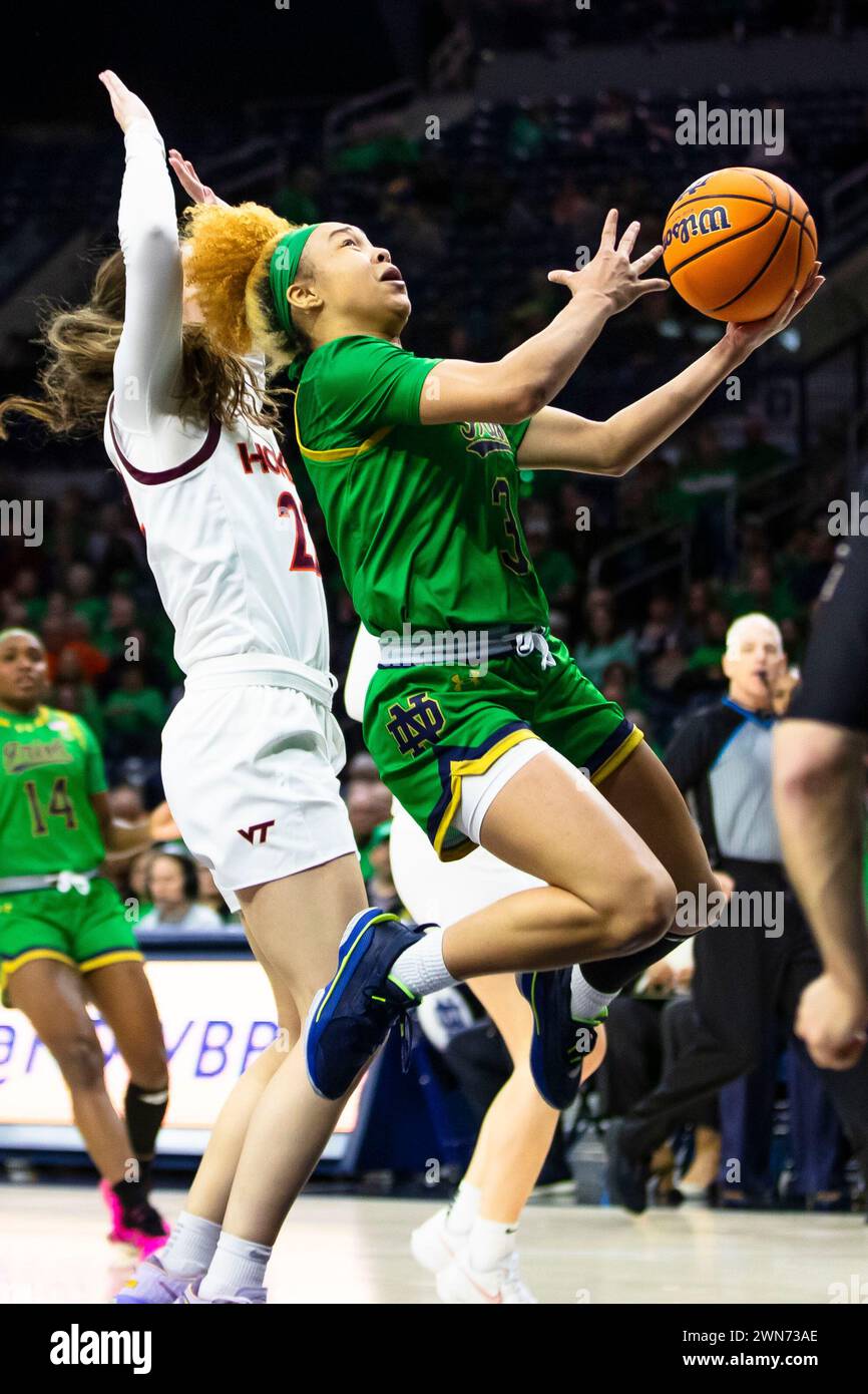 Notre Dame guard Hannah Hidalgo (3) drives past Virginia Tech guard Cayla King, front left ...