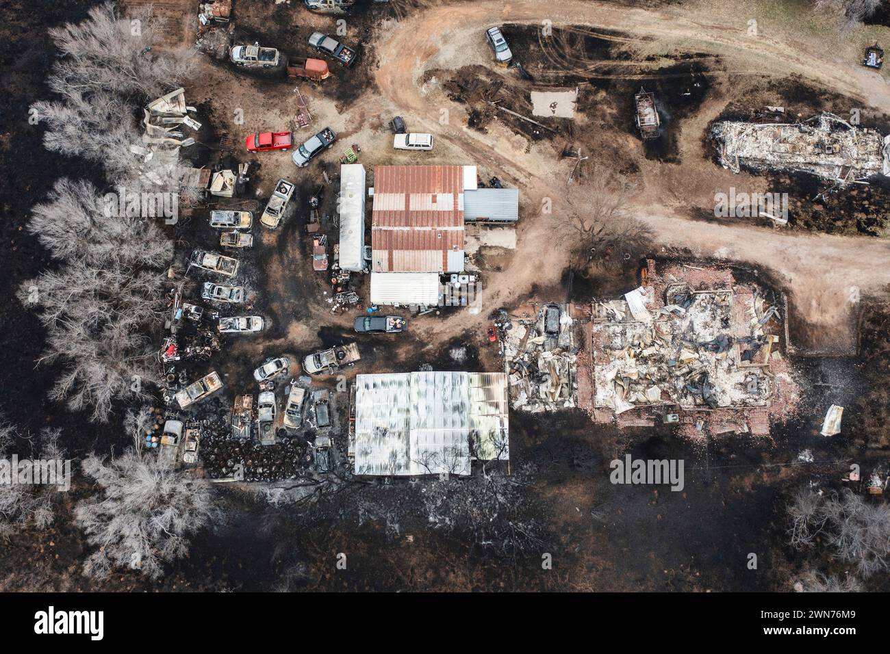 Multiple vehicles and multiple residences are seen destroyed by the ...