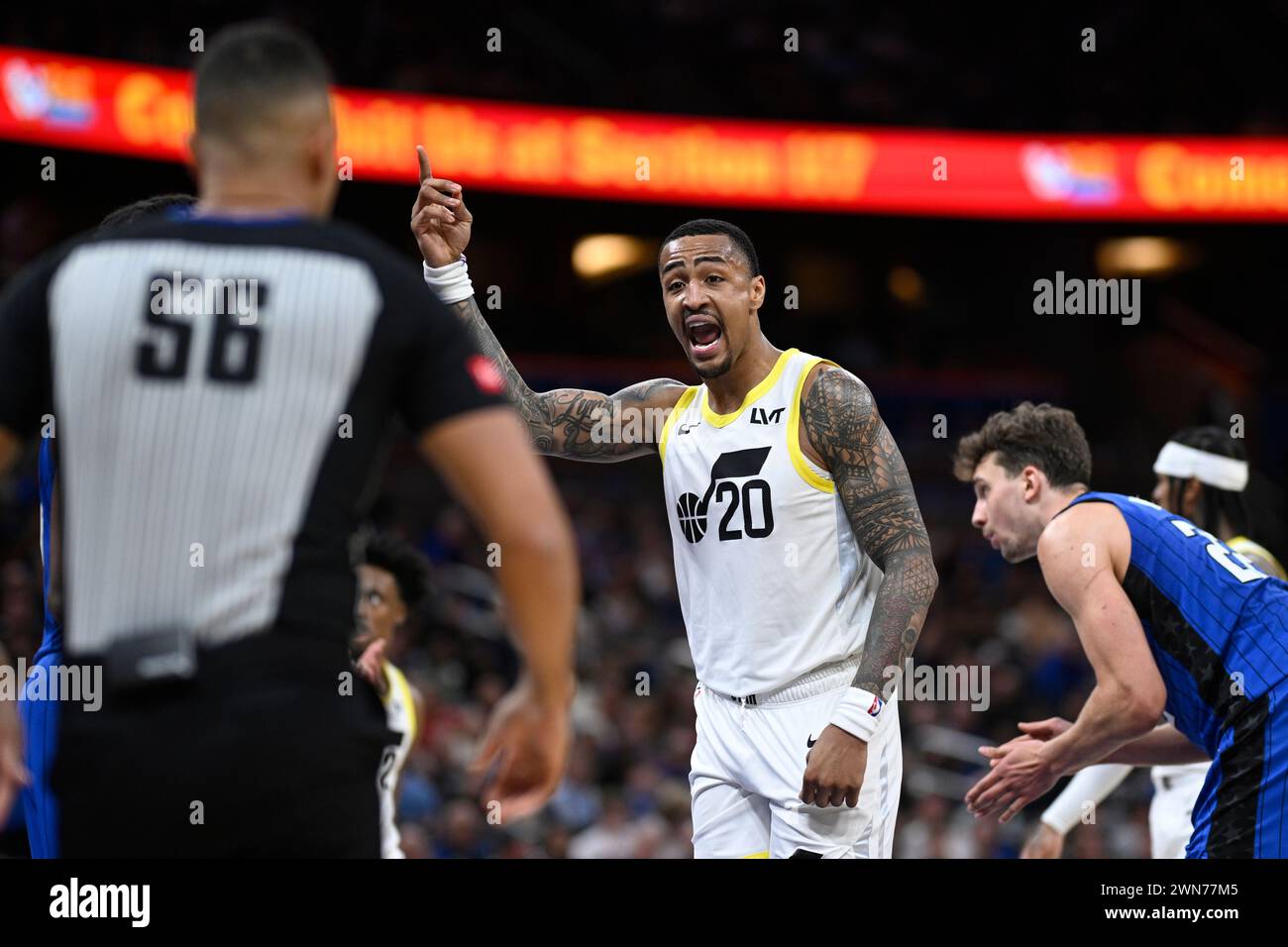 Utah Jazz forward John Collins (20) argues a call with official John ...