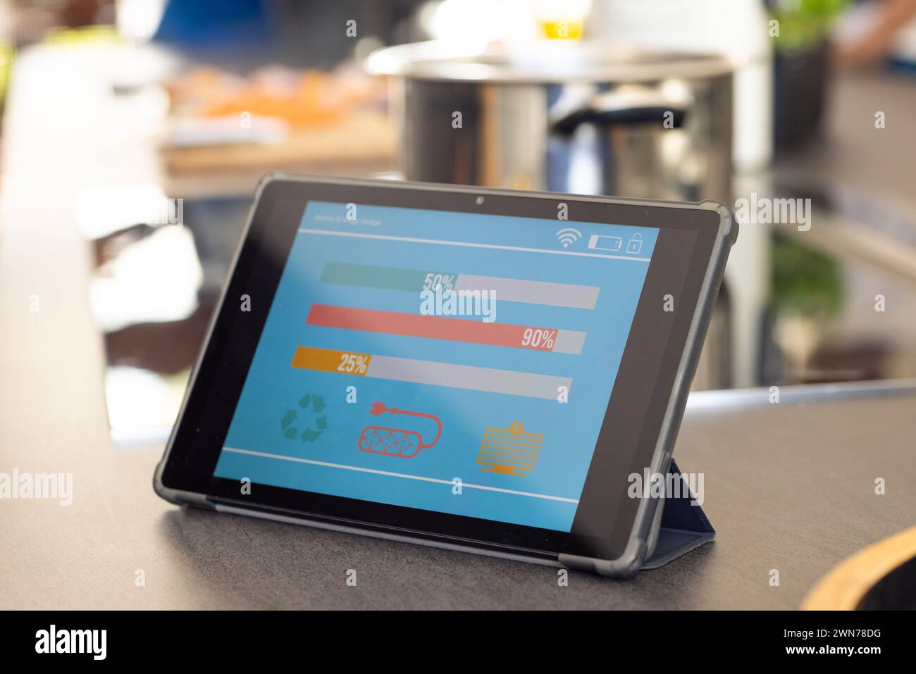 A tablet, with a smart home application on its screen, is positioned on ...