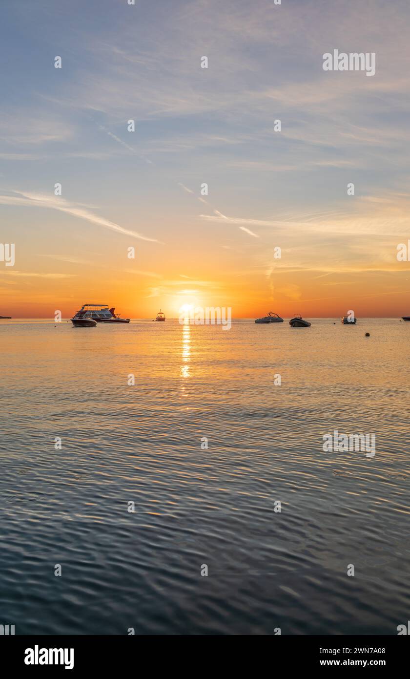 Sunrise over the sea. Panoramic seascape. Burning sky and shining ...