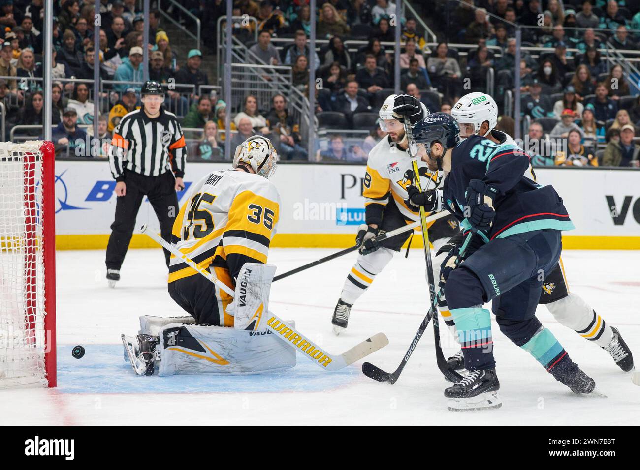 Seattle Kraken right wing Oliver Bjorkstrand (22) gets the puck past ...