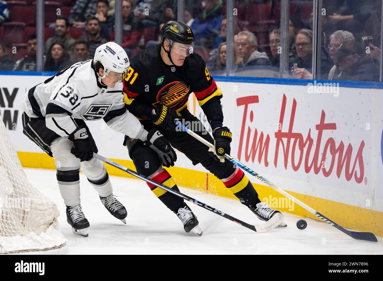 Los Angeles Kings' Alex Turcotte (38) and Vancouver Canucks' Nikita ...