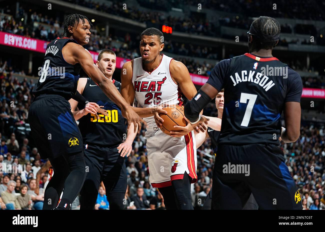 Miami Heat center Orlando Robinson, center, pulls in a rebound as ...