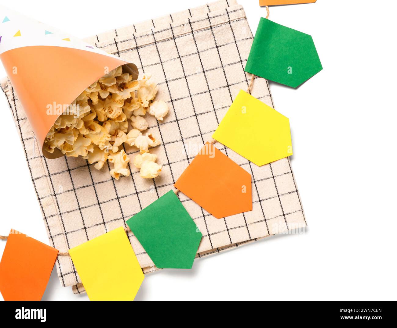Party cone with popcorn, flags and napkin on white background. Festa ...