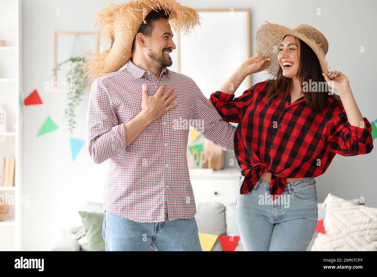 Young couple celebrating Festa Junina (June Festival) at home Stock ...