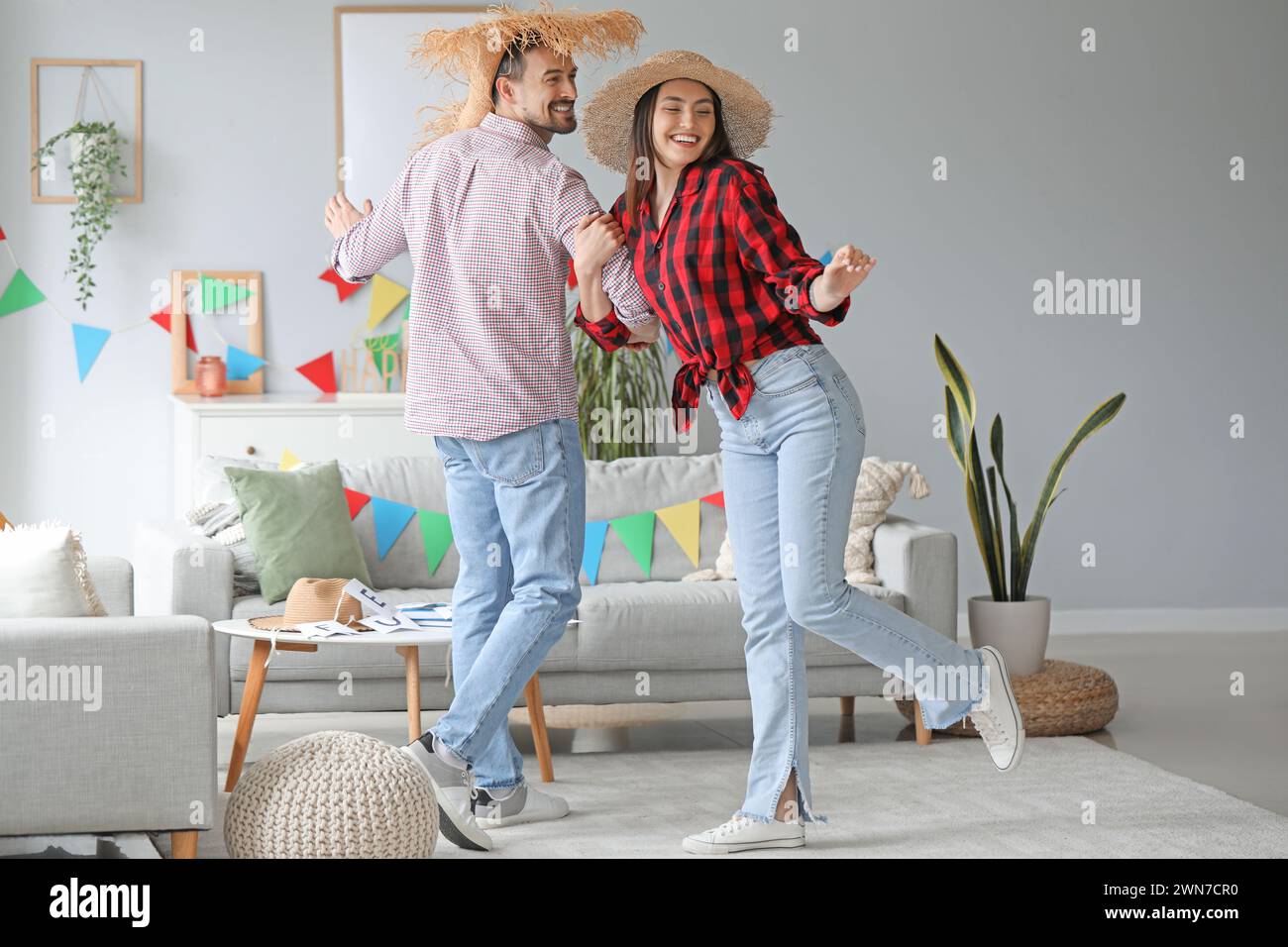 Young couple celebrating Festa Junina (June Festival) at home Stock ...