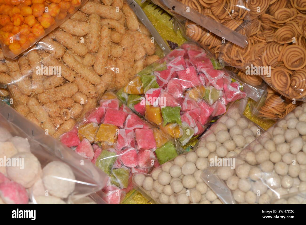 Scene view of piles of market snacks lined up. No people Stock Photo ...