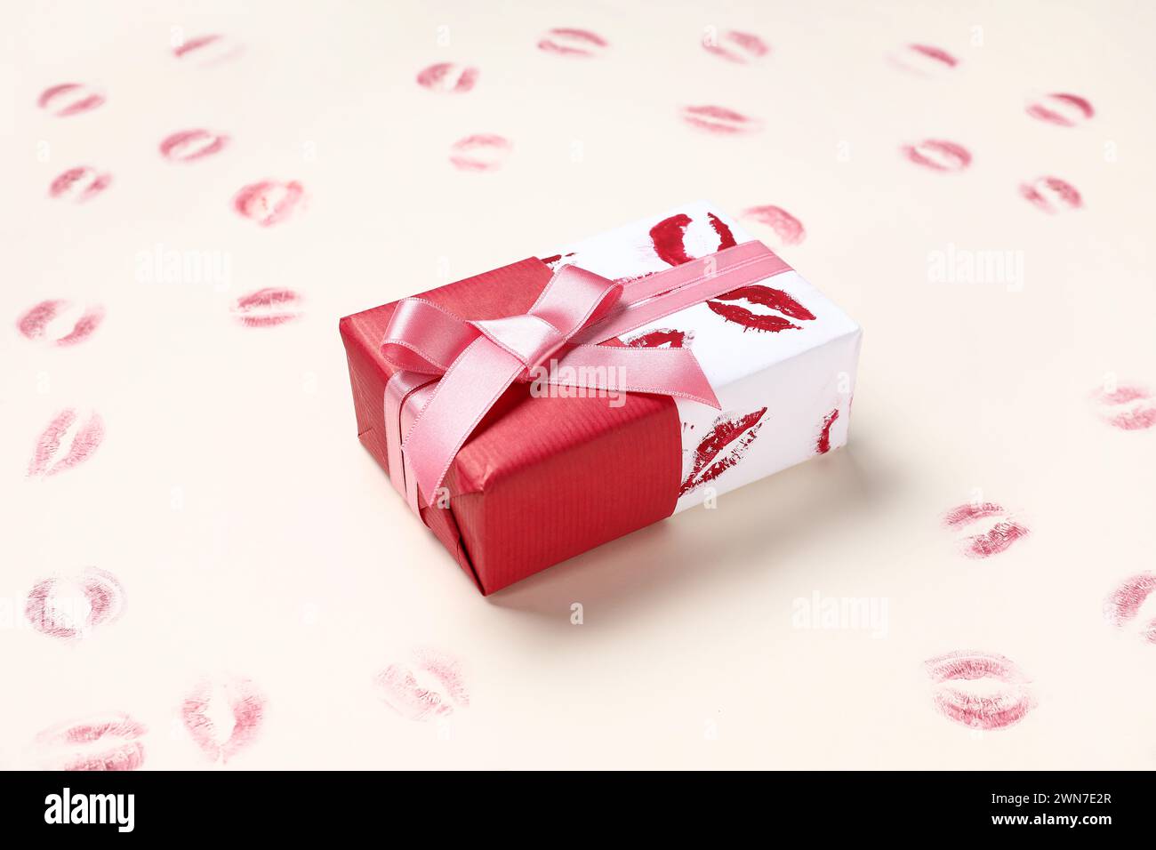 Gift box with lipstick kiss marks on yellow background. Valentine's Day celebration Stock Photo ...
