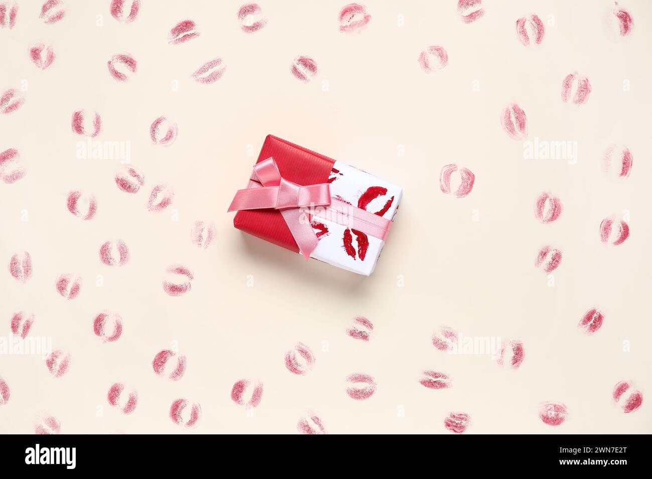 Gift box with lipstick kiss marks on yellow background. Valentine's Day celebration Stock Photo ...