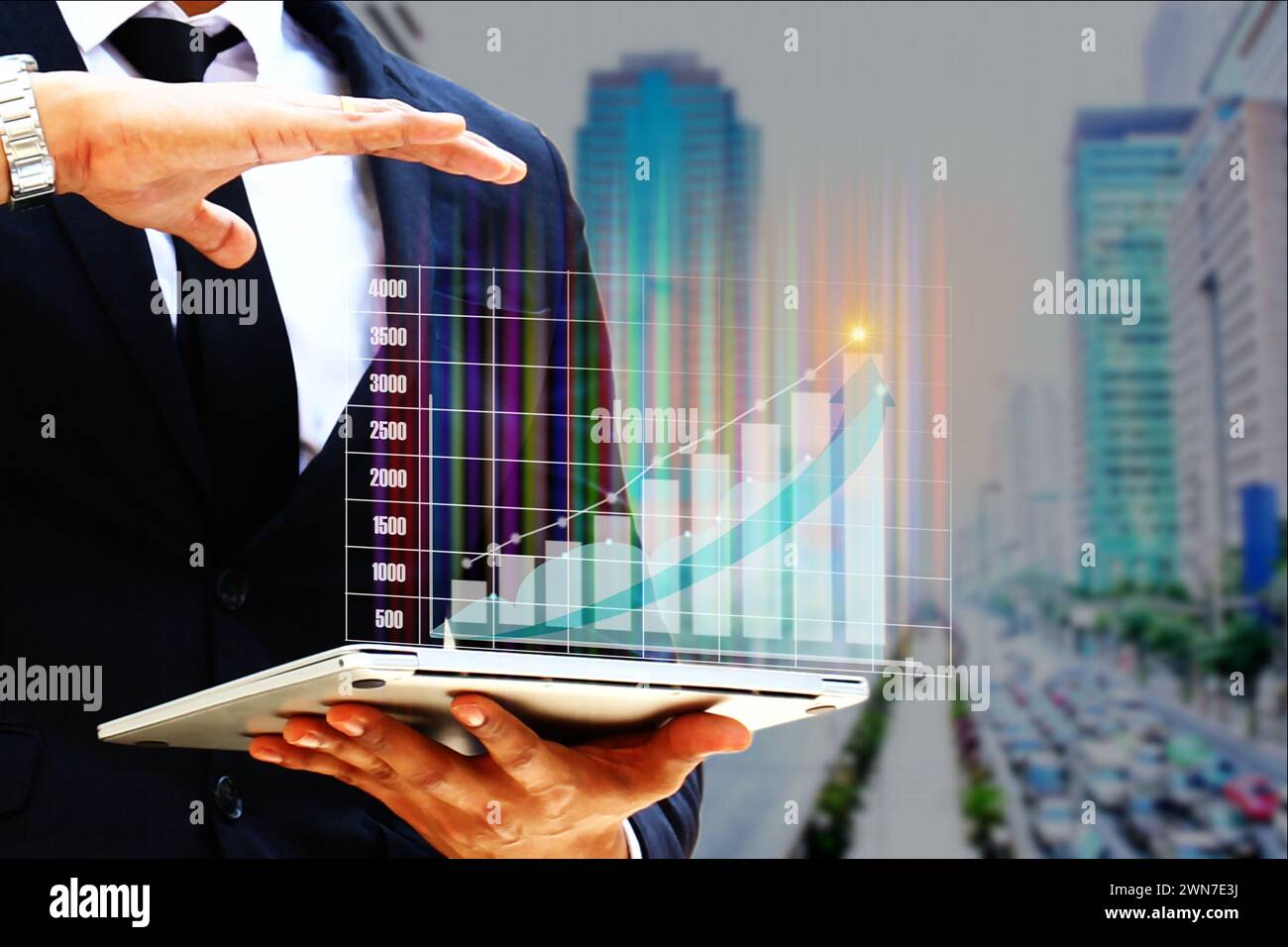 business man using laptop showing graphic earning company chart of this ...