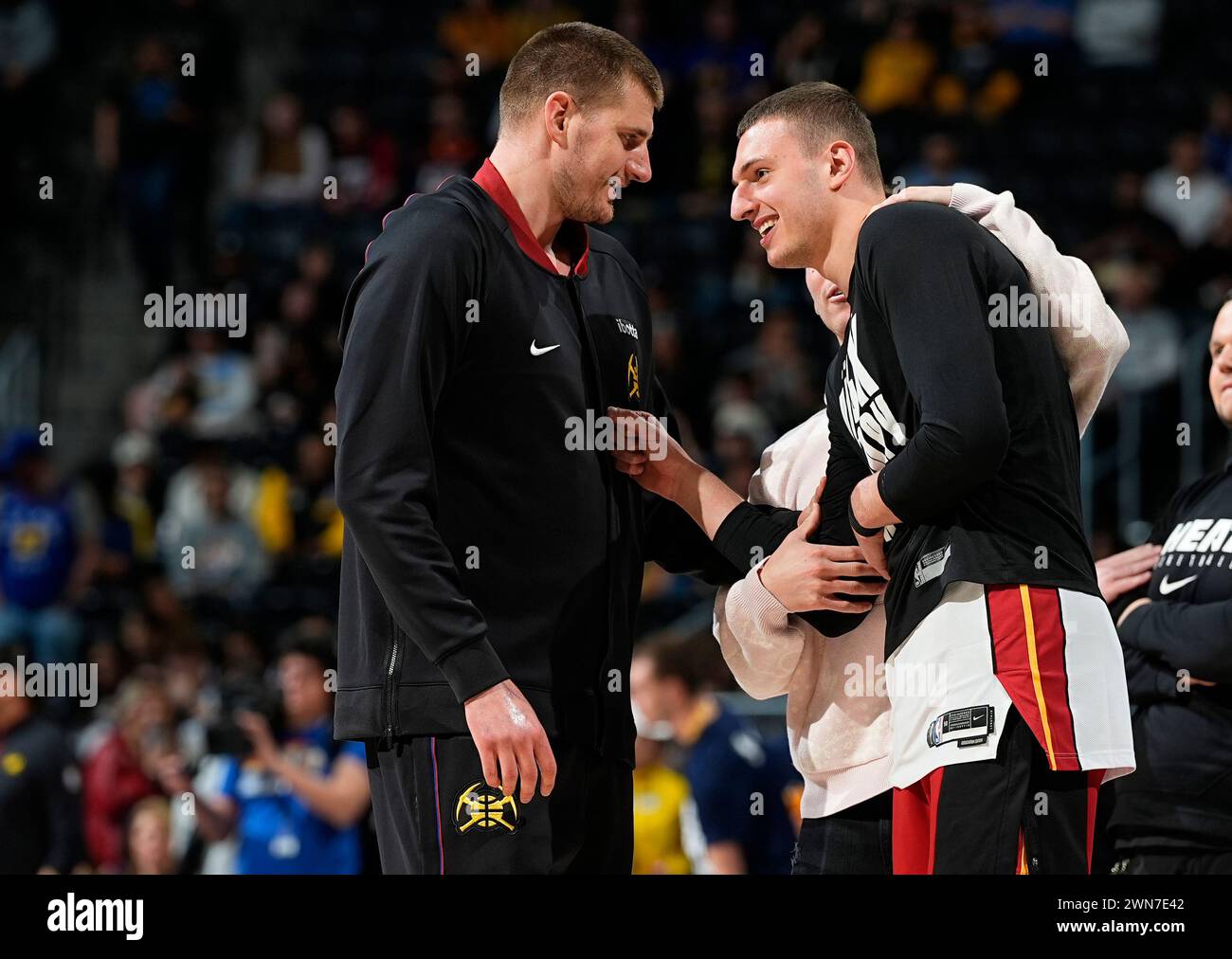 Denver Nuggets center Nikola Jokic, left, greets Miami Heat forward ...