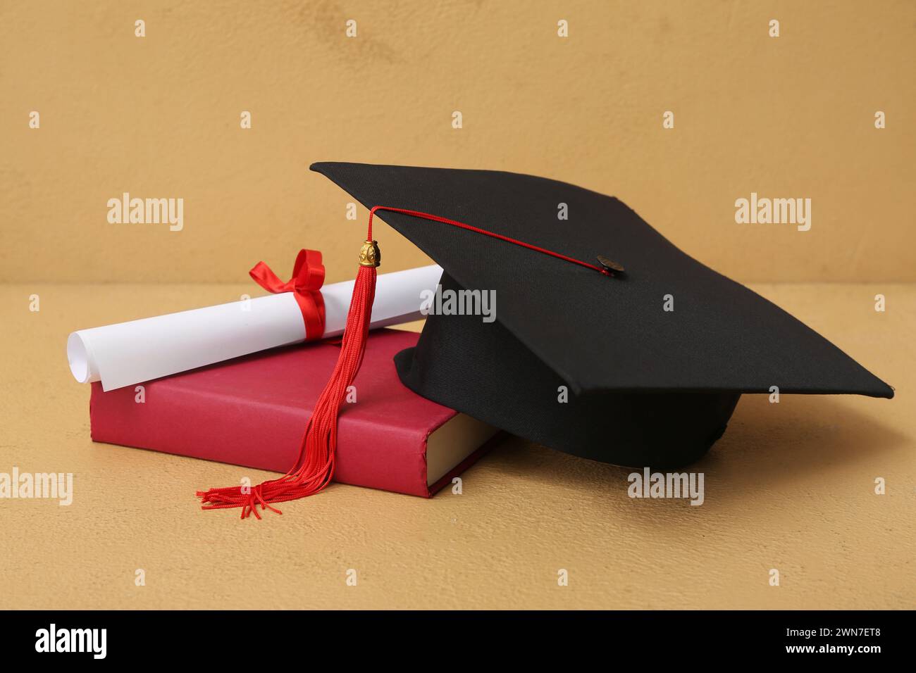 Diploma book mortar board hi-res stock photography and images - Alamy