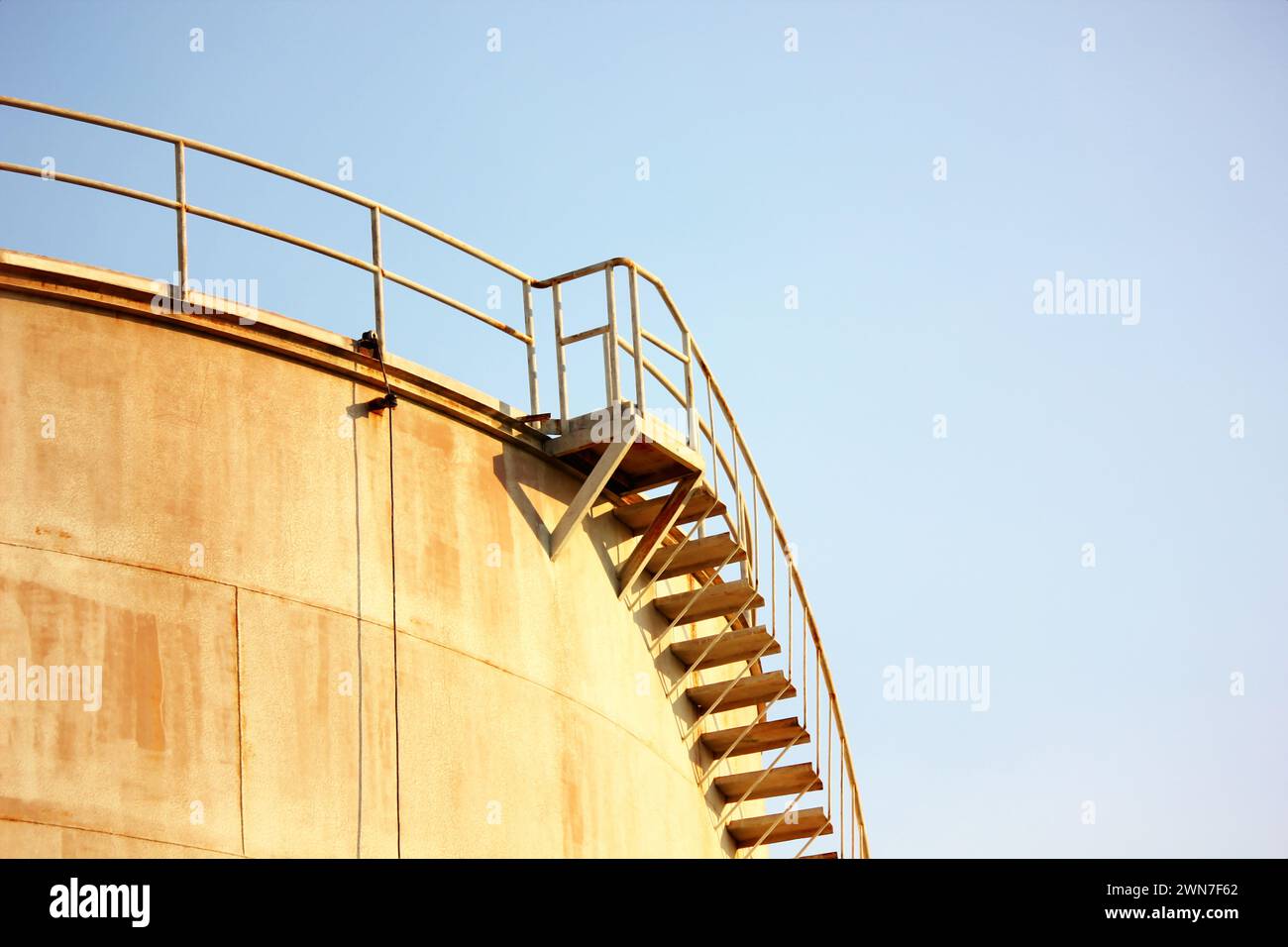 the iron stairs on oil stock tank Stock Photo - Alamy