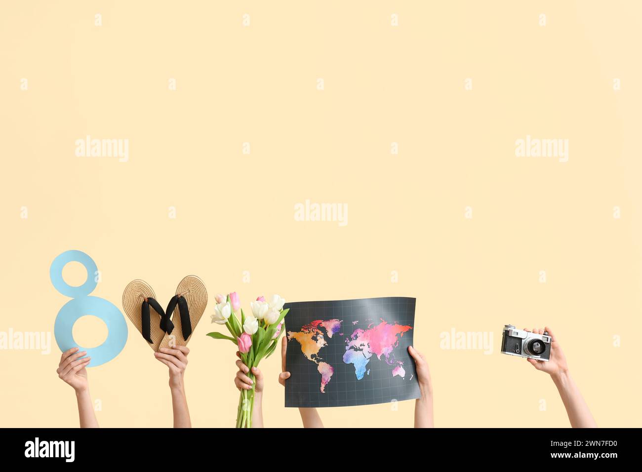 Female hands with paper figure 8, world map, flip-flops and flowers for ...