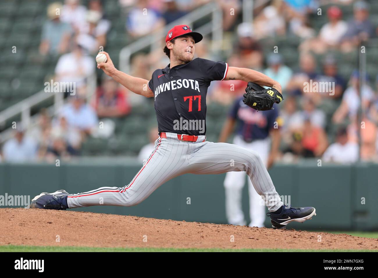 North Port FL USA; Minnesota Twins pitcher Ryan Jensen (77) delivers a ...