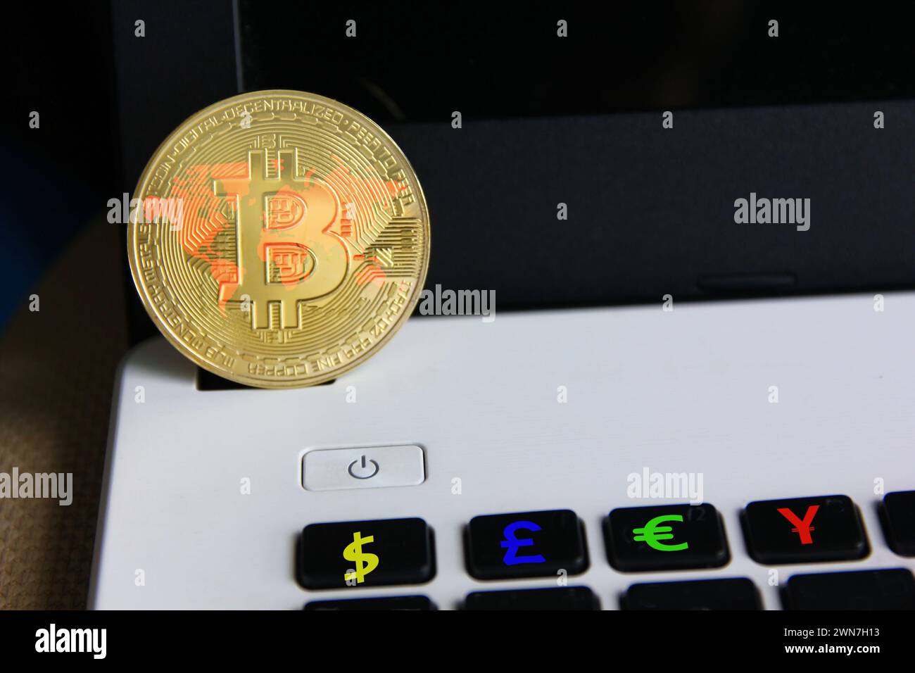 world map on bitcoin with power button on laptop , money sign on button ...