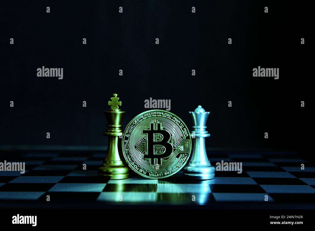 bit coin between golden king chess silver queen chess on board isolate ...