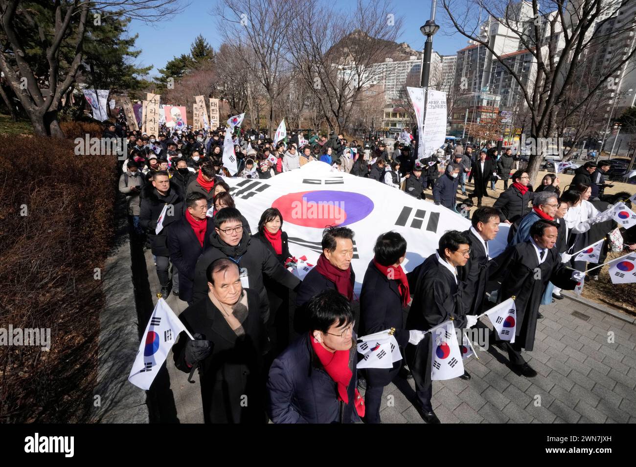 South Koreans march during a ceremony to celebrate the March First ...