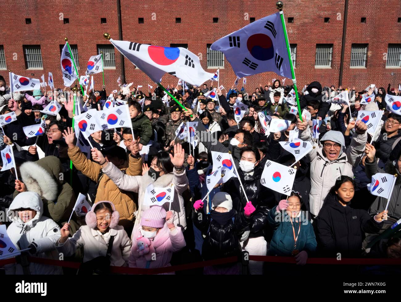 South Koreans cheer for the country during a ceremony to celebrate the ...
