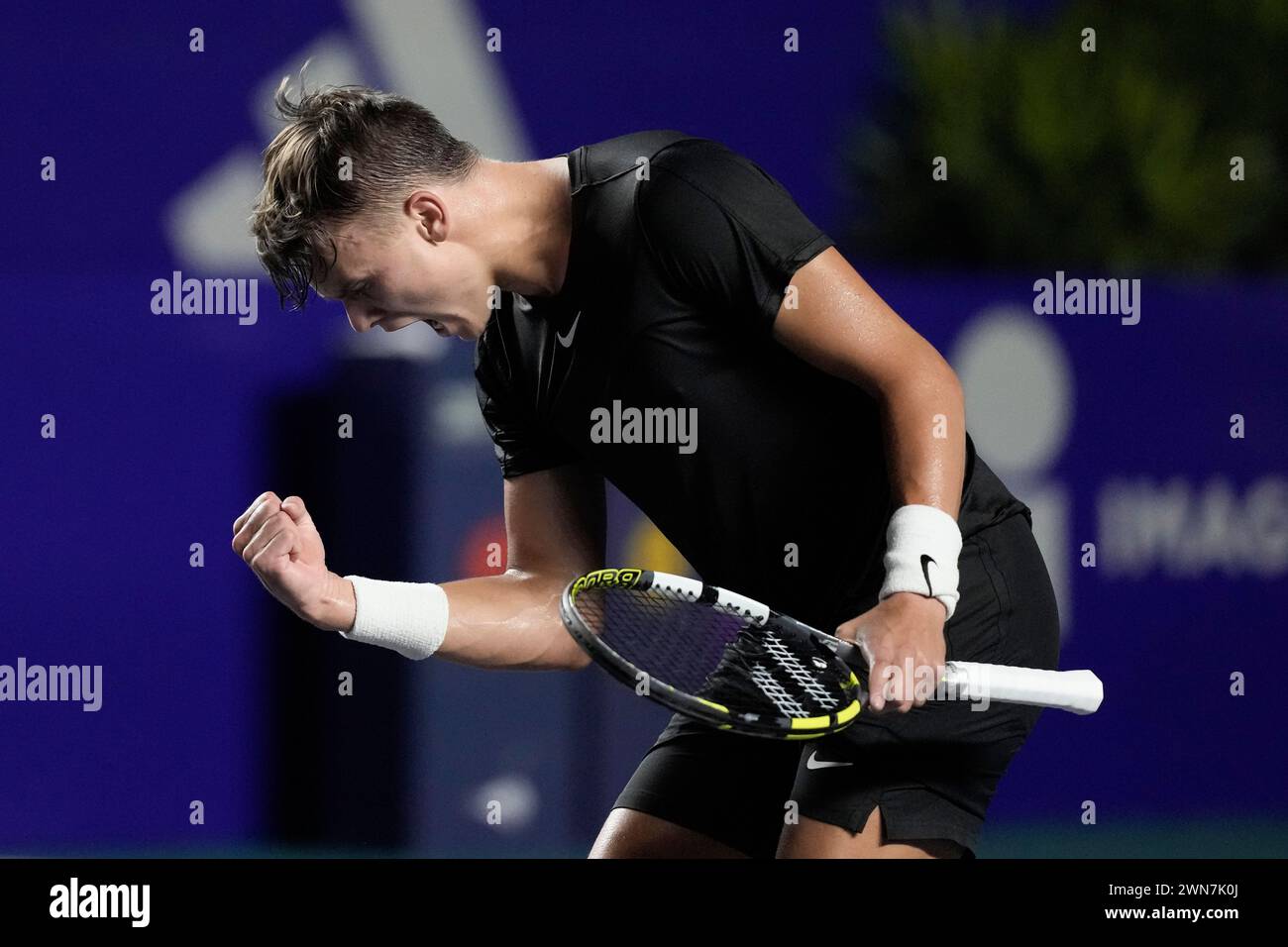 Holger Rune, of Denmark, celebrates after defeating Dominik Koepfer, of ...