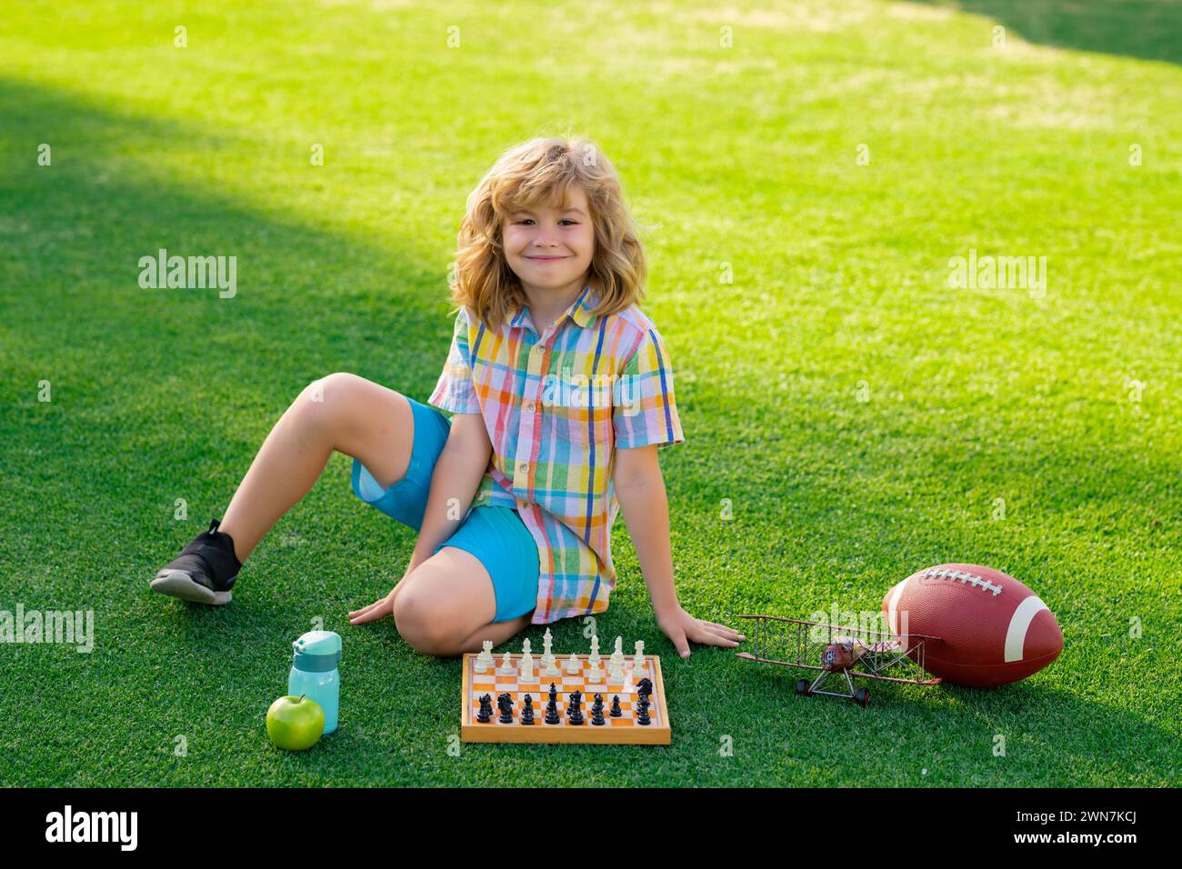 Little kid chessman play chess game, checkmate. Child playing chess in ...