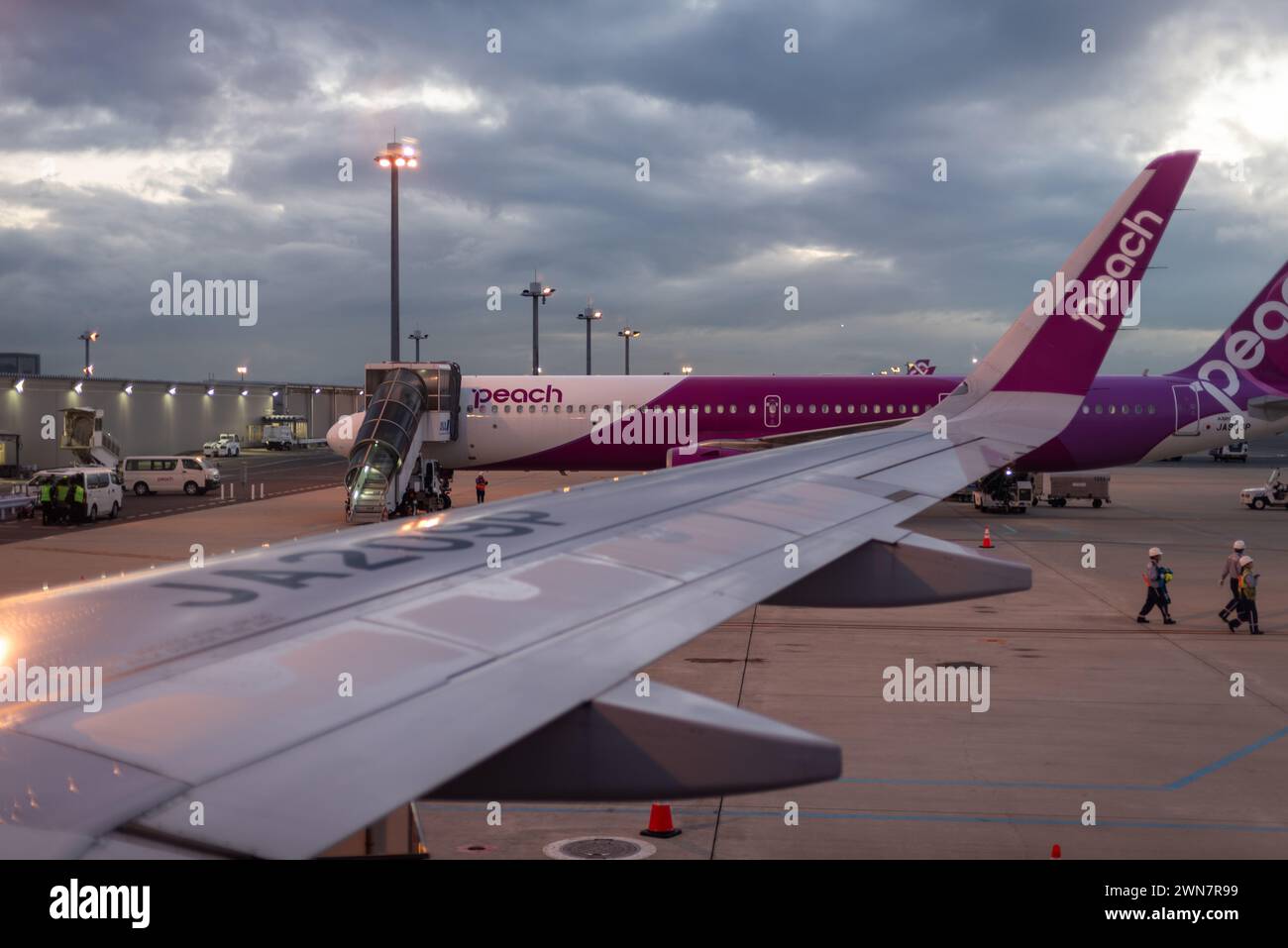 Low cost Peach Aviation planes on the runway of Kansai International ...