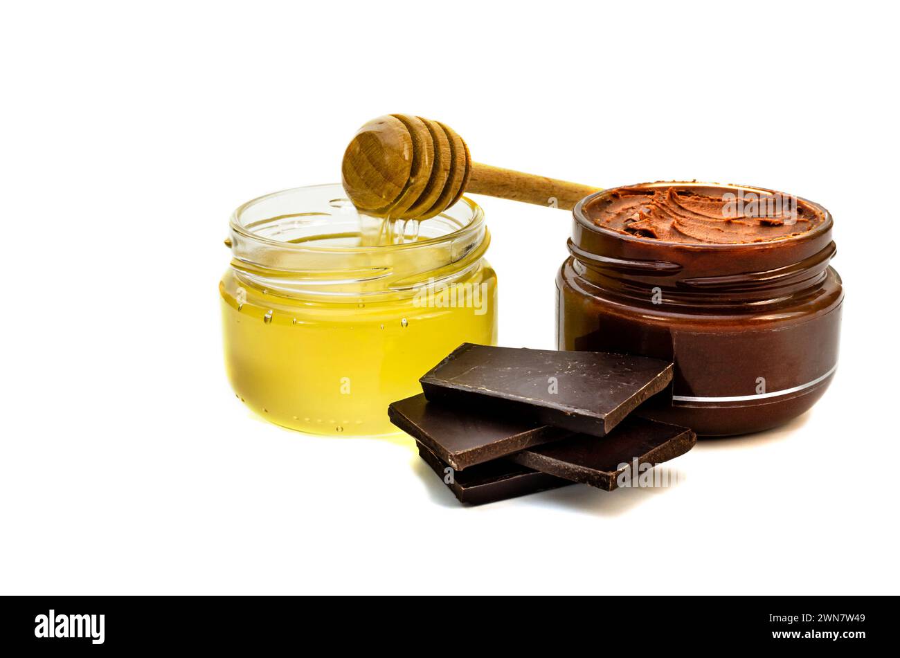 Honey chocolate paste in a glass jar on an isolated white background ...