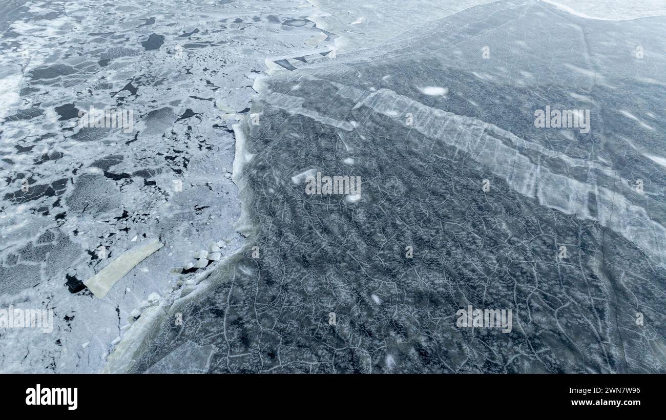 Aerial top-down view to the textures and patterns of the cracked sea ...