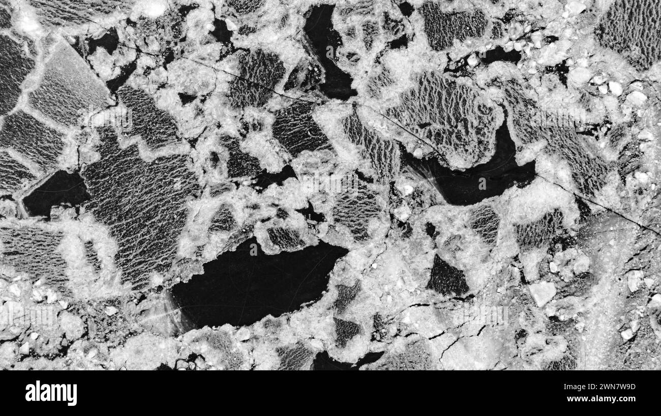 Aerial top-down view to the textures and patterns of the cracked sea ...