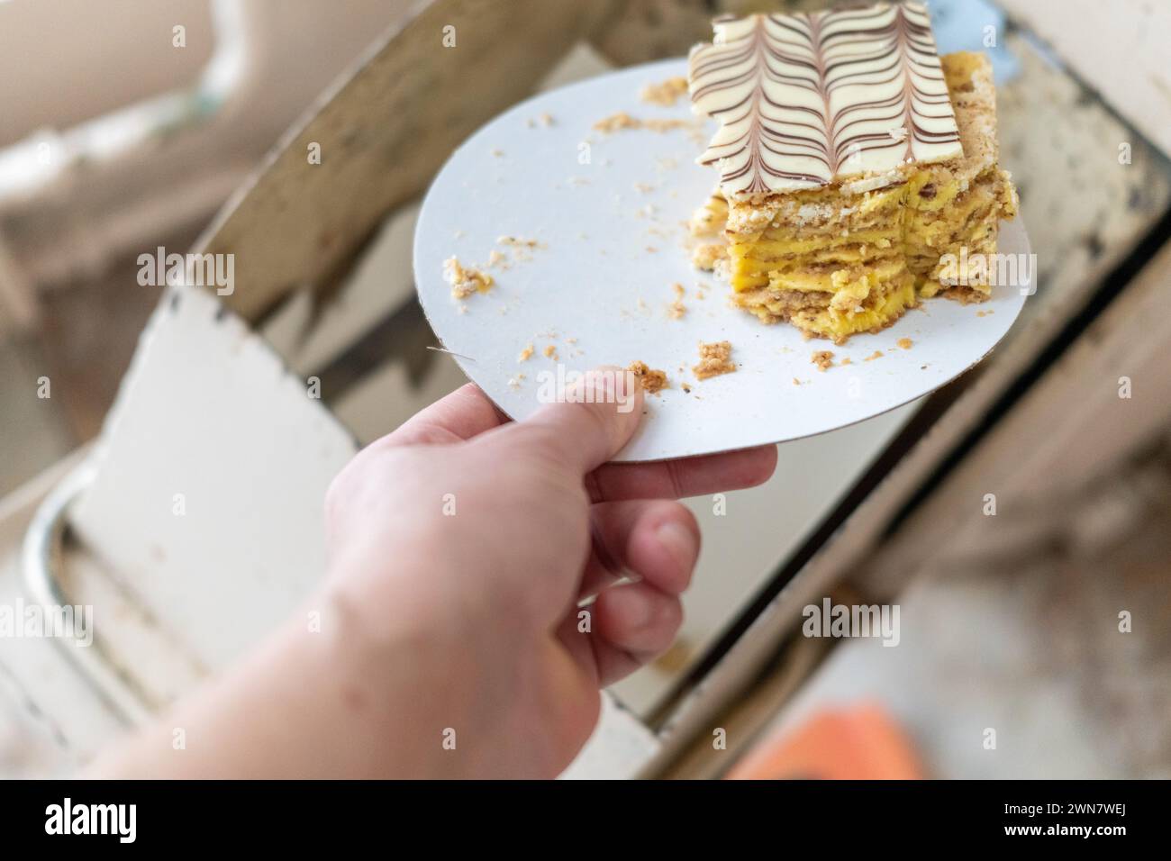 a hand discarding a brownie into a trash chute, indoor close up Stock ...