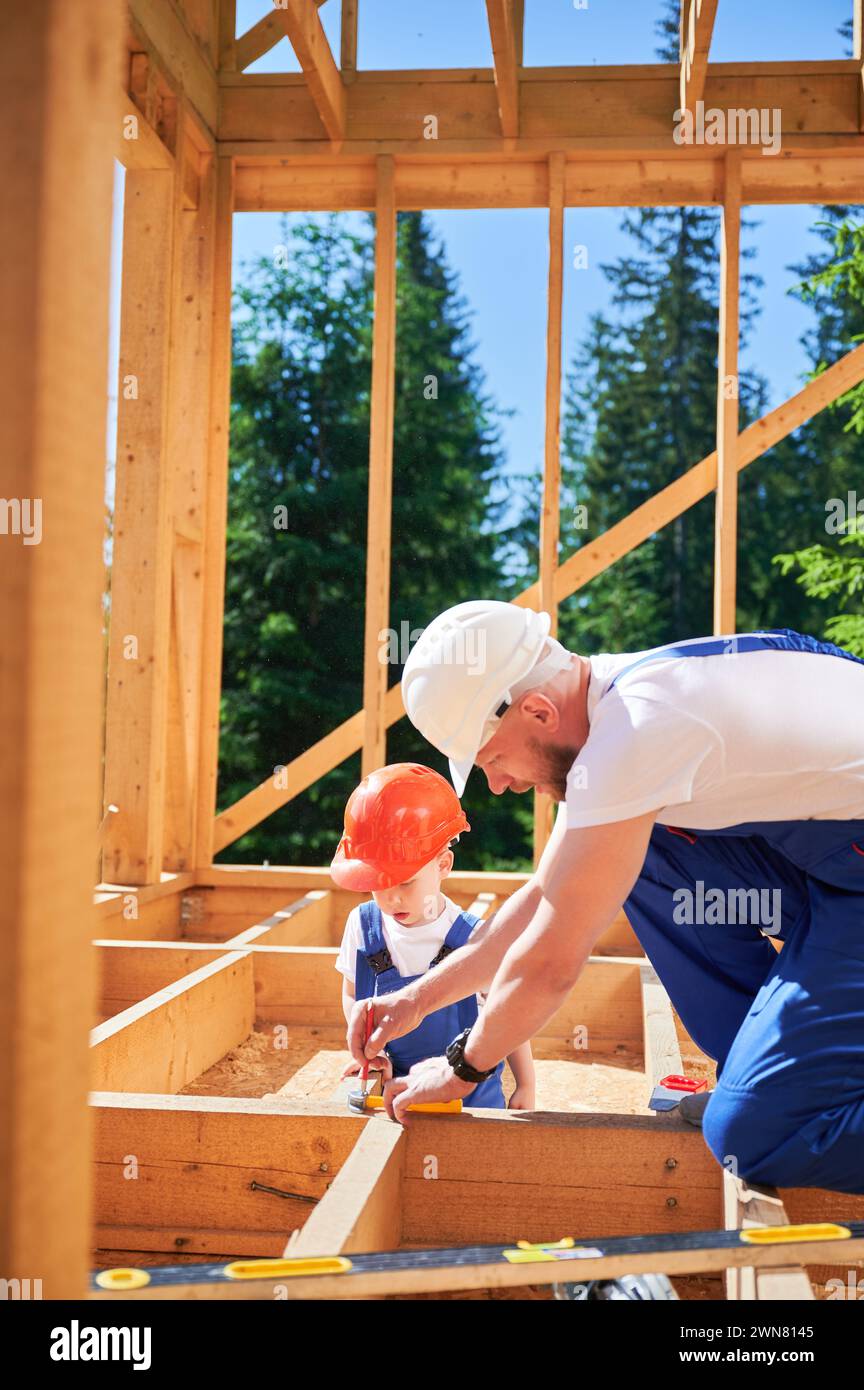 Father son wearing construction helmets hi-res stock photography and ...