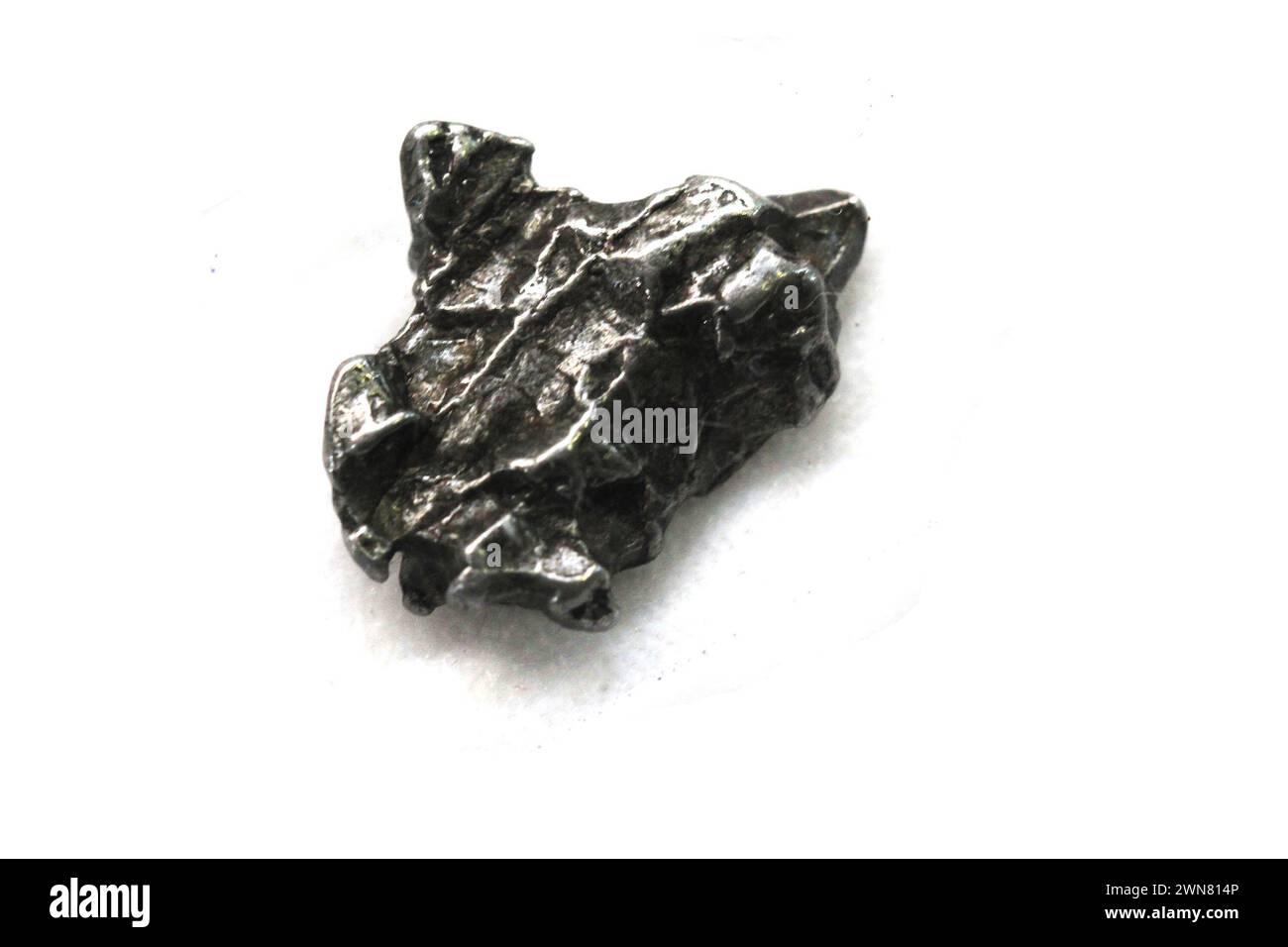 metal meteorite isolated on the white background Stock Photo - Alamy