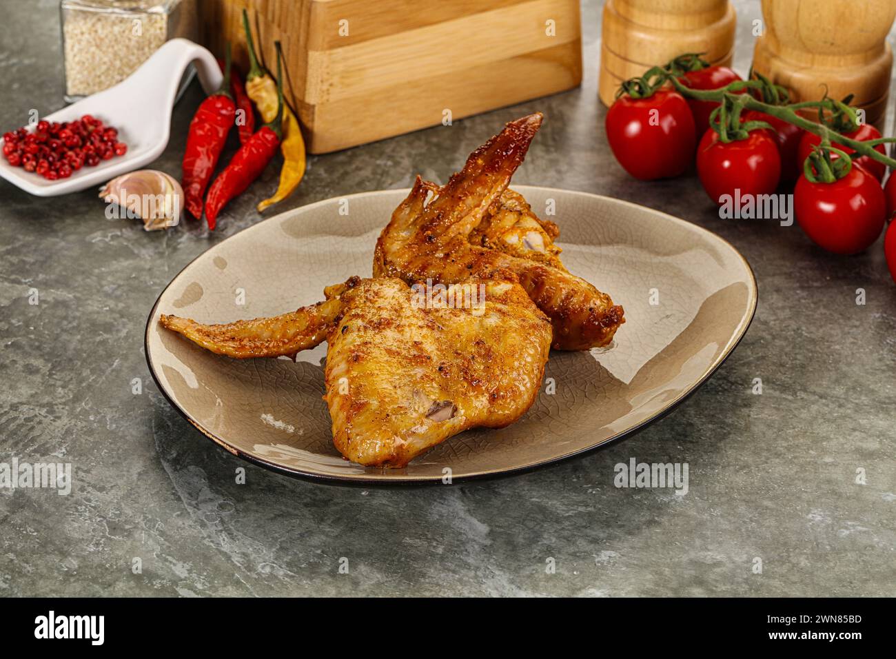 Tasty roasted chicken wing with spices and herbs Stock Photo - Alamy