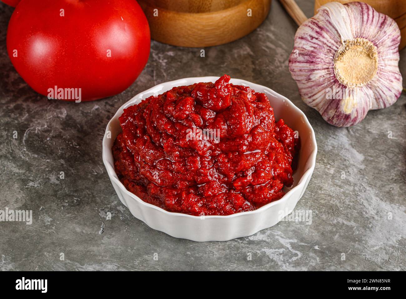 Natural organic red tomato paste in the bowl Stock Photo - Alamy