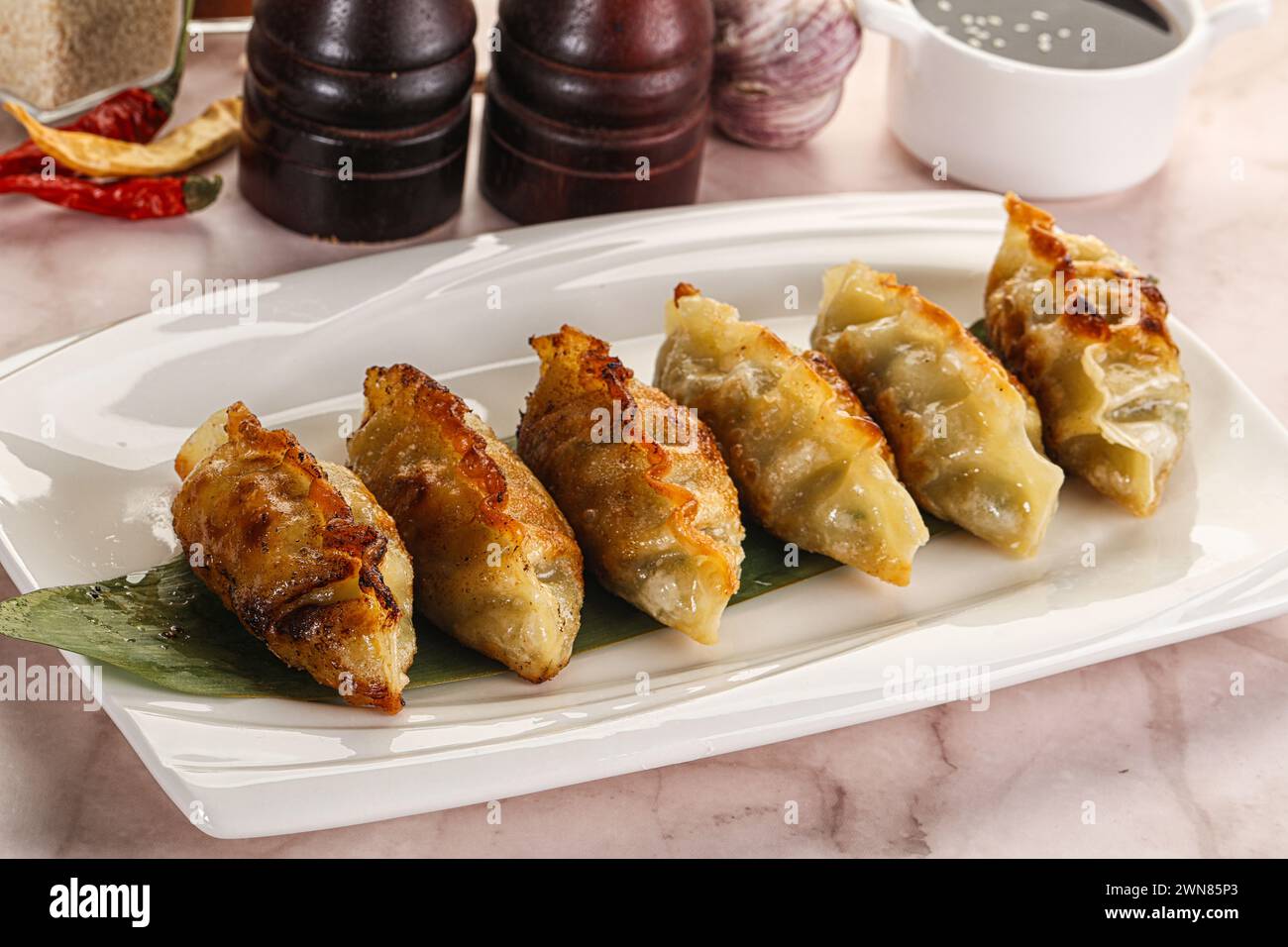 Fried Japanese stuffed dumplings - Gyoza with meat Stock Photo - Alamy