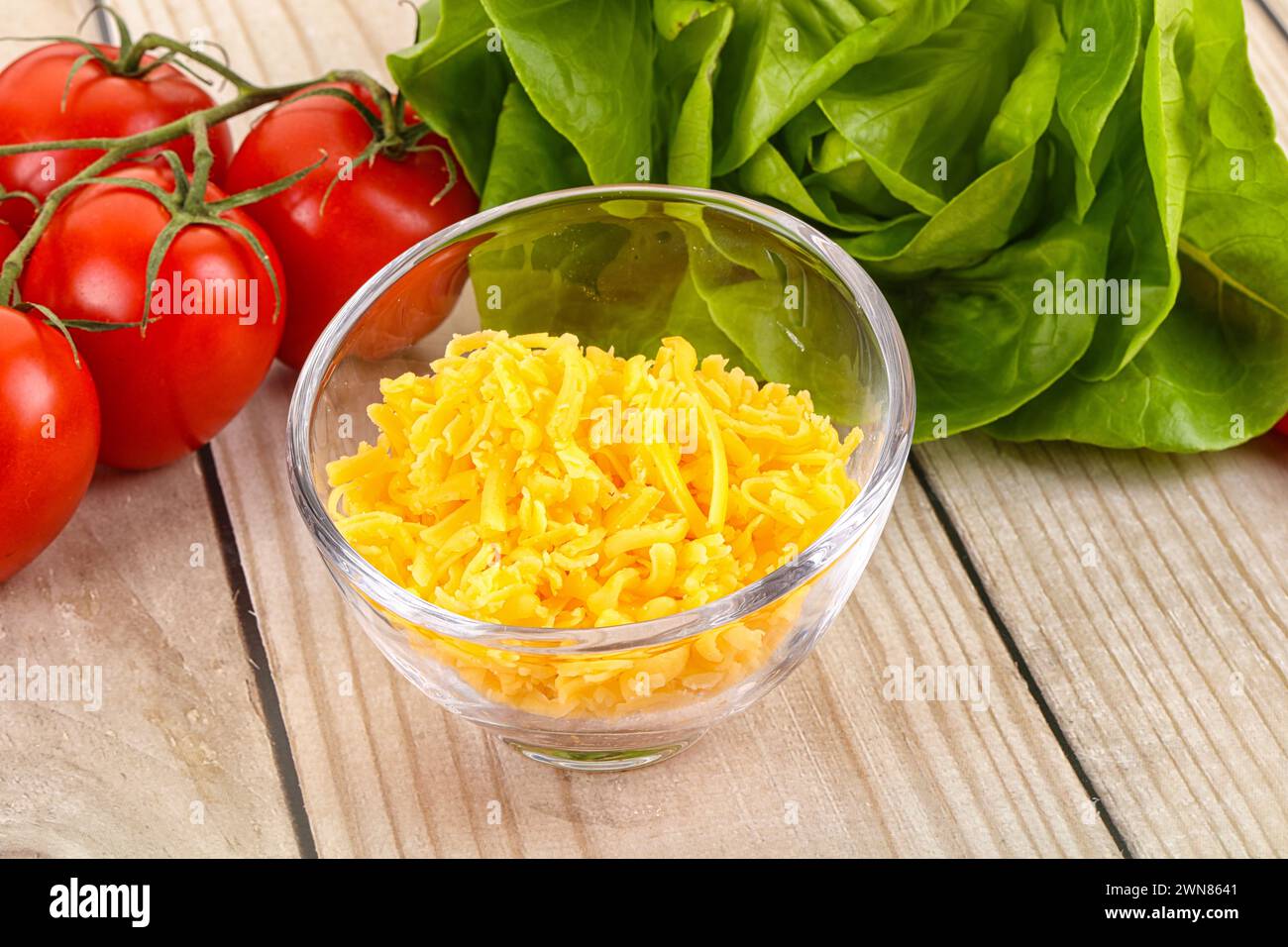 Shredded yellow cheese in the bowl Stock Photo - Alamy