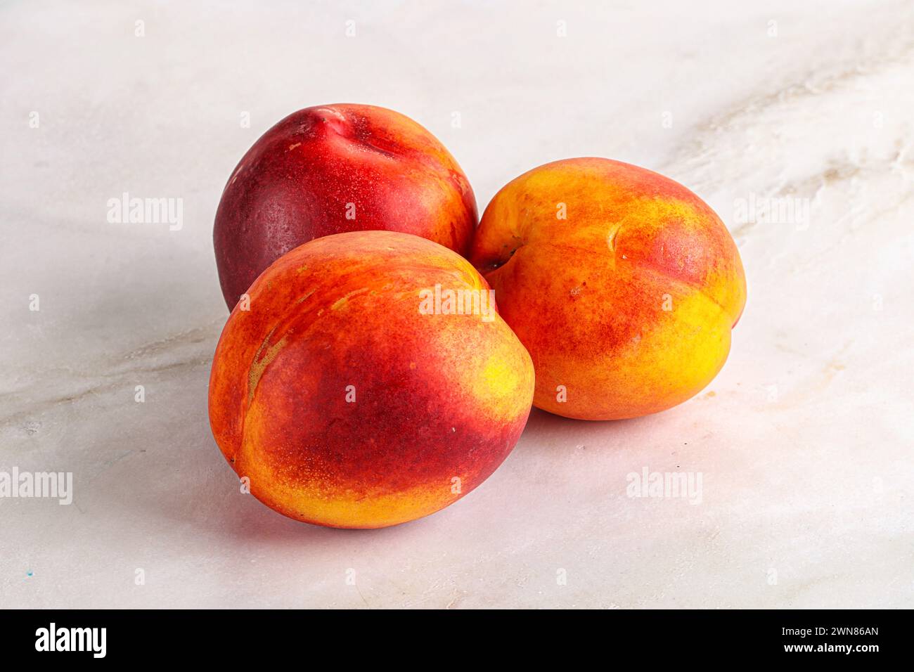 Ripe sweet juicy fresh red nectarines heap Stock Photo - Alamy