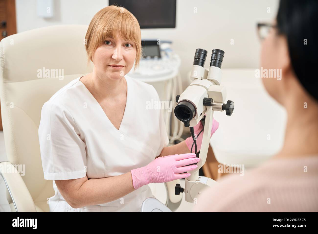 Qualified doctor gynecologist going to do gynecological examination of ...