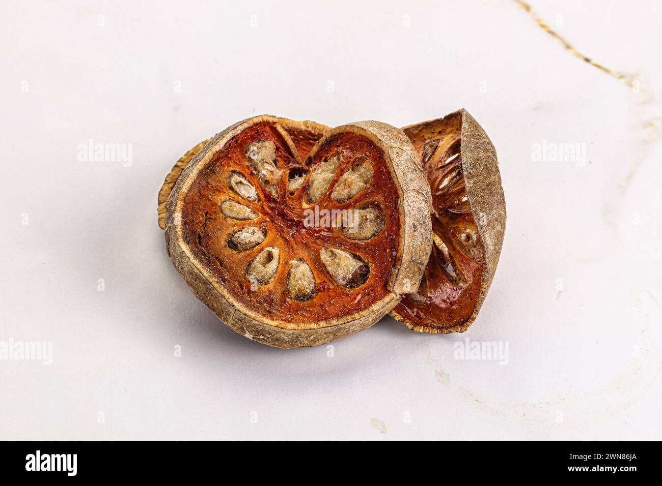 Thai cuisine - dry bael fruit for drinks Stock Photo - Alamy