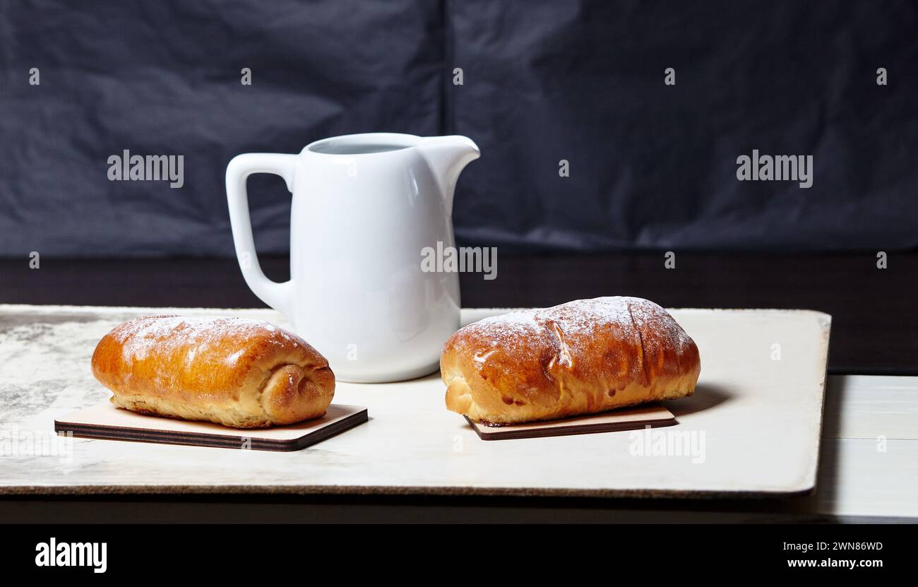 Homemade buns with jam with powdered sugar on wooden background. Fresh ...