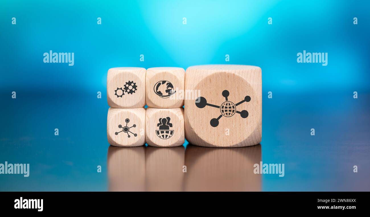 Wooden blocks with symbol of globalization concept on blue background ...