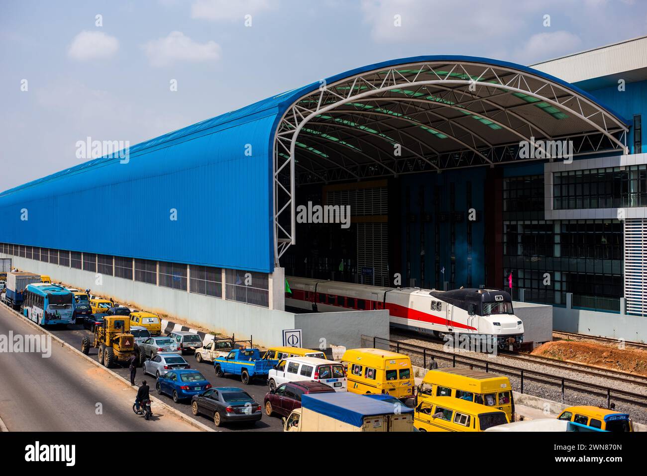 A train departs the Ikeja terminal during the commissioning of the Red Line rail Mass transit in ...