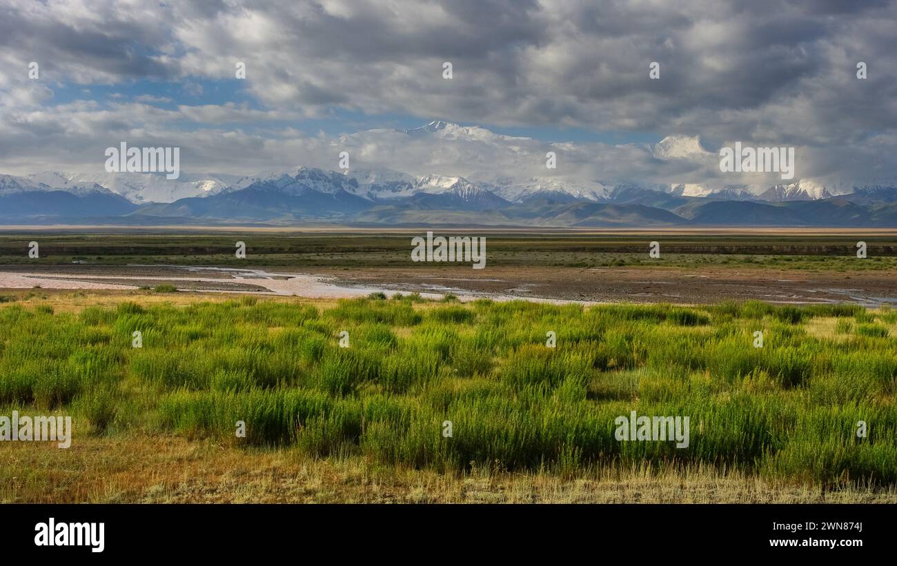 Landscape view of Lenin Peak aka Ibn Sina peak in the snow-capped Trans ...
