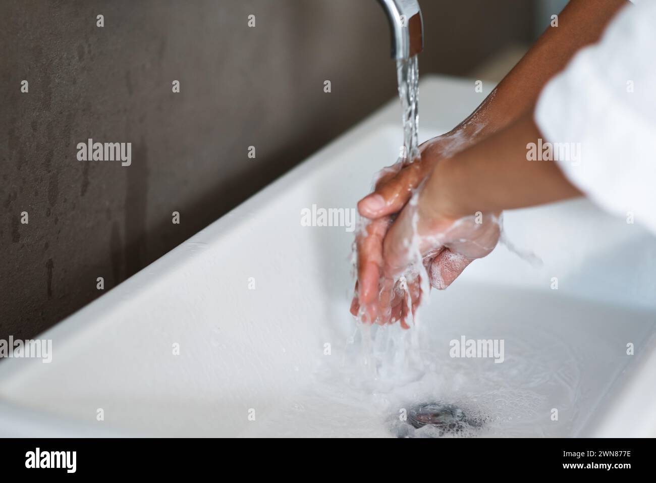 Hands, water and cleaning for hygiene and skincare, splash in basin ...